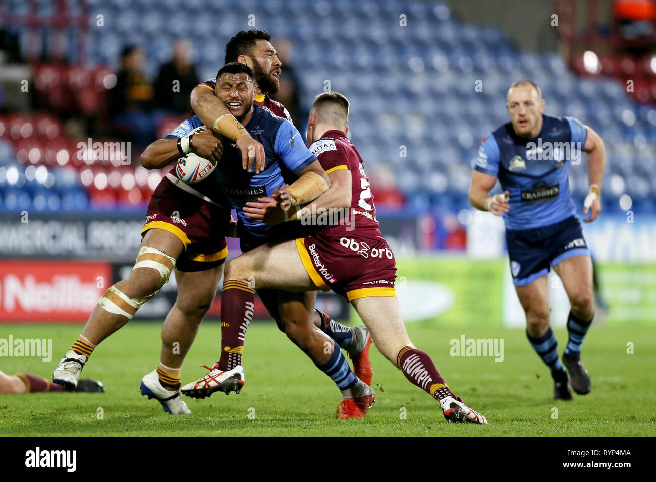 St Helens' Dominique Peyroux is tackled by Huddersfield Giants' Suaia ...
