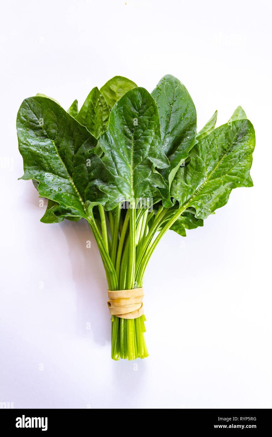 Bunch of green fresh organic spinach leaves close up copy space top ...