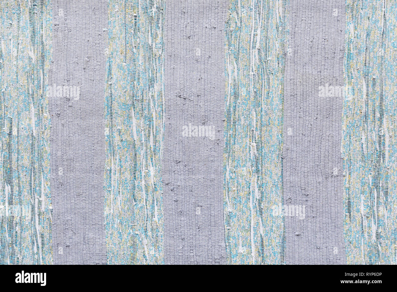 Full frame background of a colorful homemade rag rug viewed from above ...