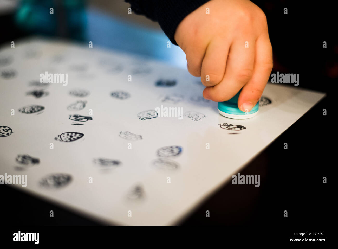 Inking the paper Stock Photo - Alamy