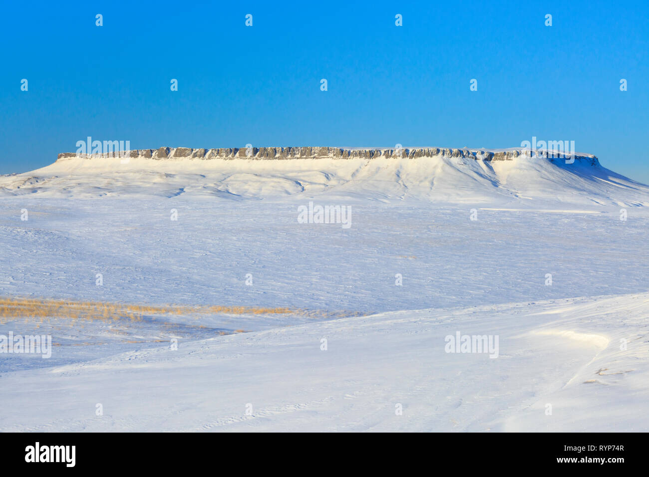 snow-covered prairie hills below square butte near ulm, montana Stock ...