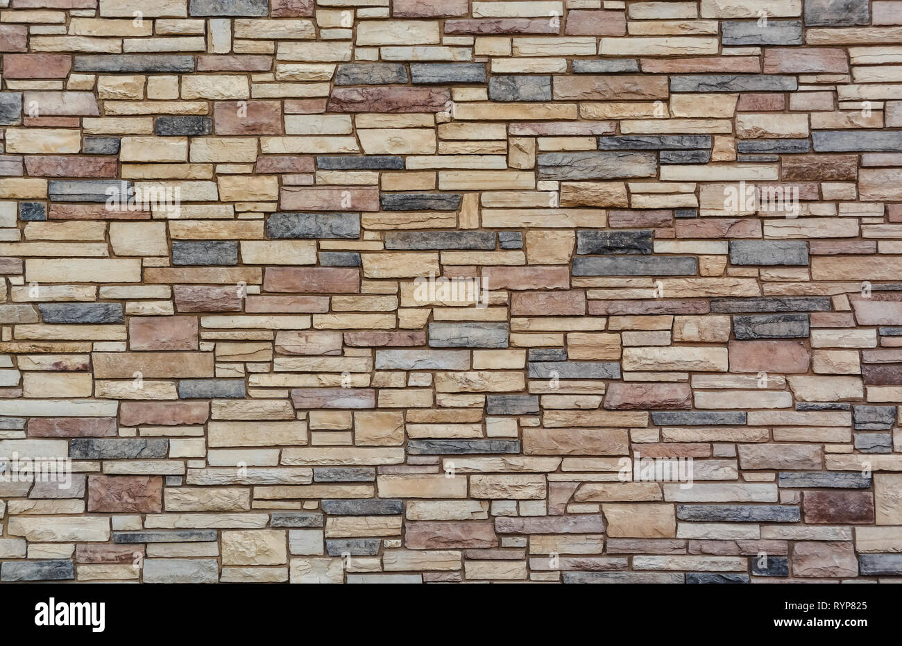 Brown colored stone setting. Cut stone wall texture Stock Photo - Alamy