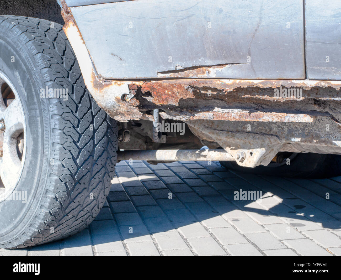 rusty bottom of old vintage car. close-up outdoor image. impregnation ...