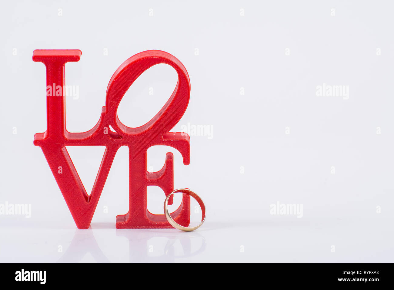 red love letters on white background on the left wiht ring Stock Photo ...