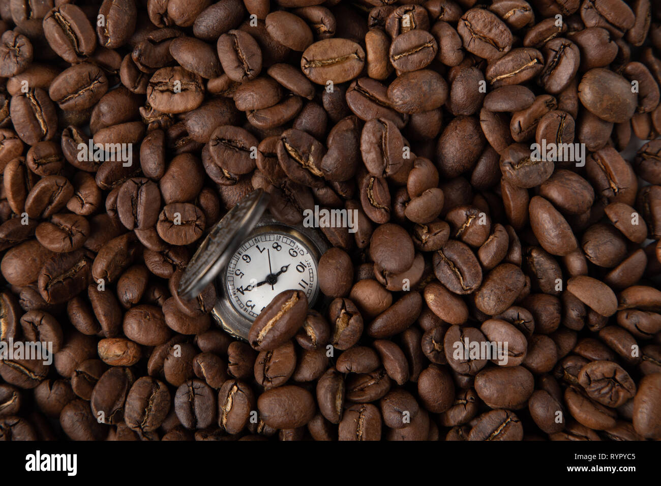Vintage watch with coffee Stock Photo - Alamy