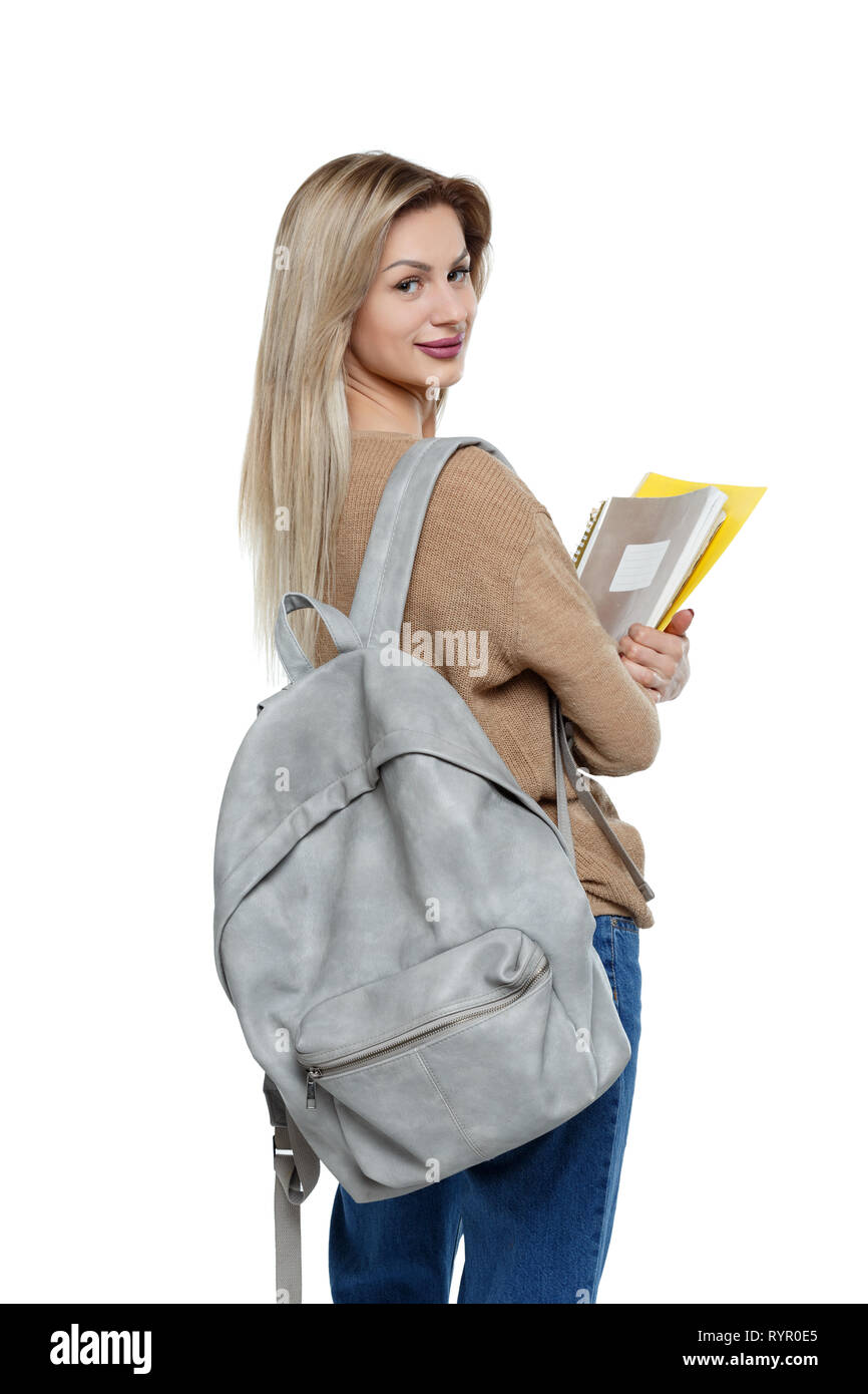 Back view of woman student. girl with the backpack and textbooks. Rear ...