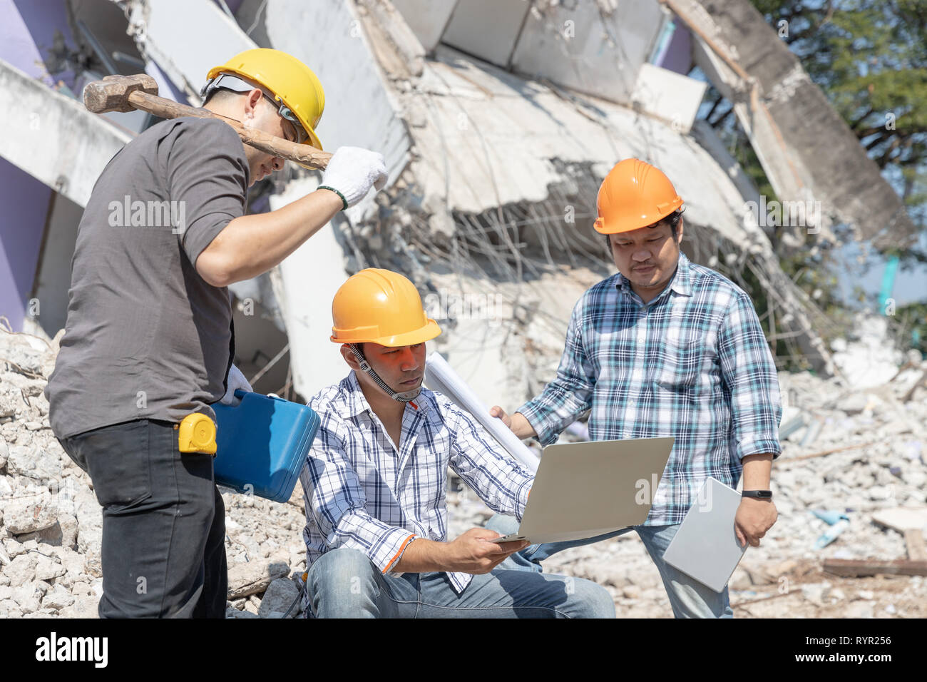 Engineer architect and worker operation control demolish old building ...