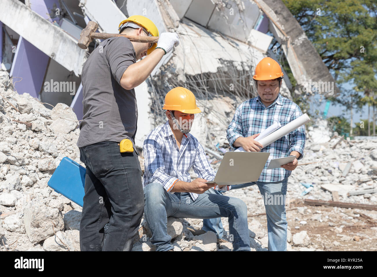 Engineer architect and worker operation control demolish old building ...