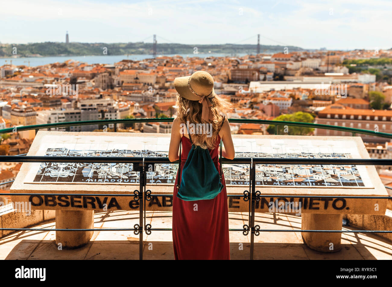 Young female tourist wearing generic dress taking a tour in southern ...