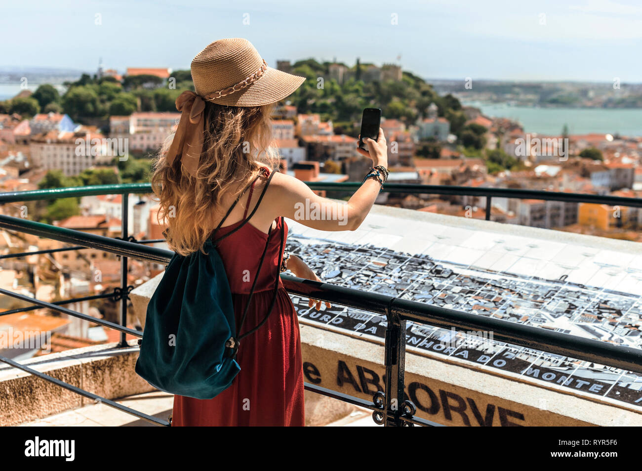 Young female tourist wearing generic dress taking a tour in southern ...