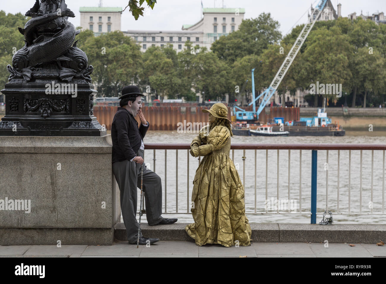 Charlie Chaplin having a yawn by the River Thames in London Stock Photo ...