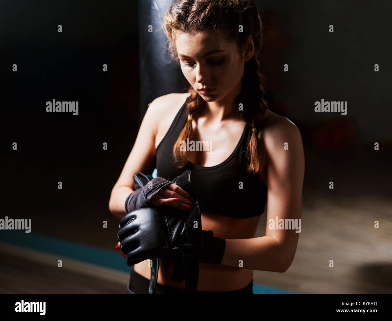 Young fighter boxer girl wearing boxing gloves before training Stock ...