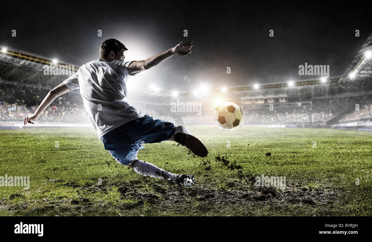 Soccer player at stadium. Mixed media Stock Photo - Alamy
