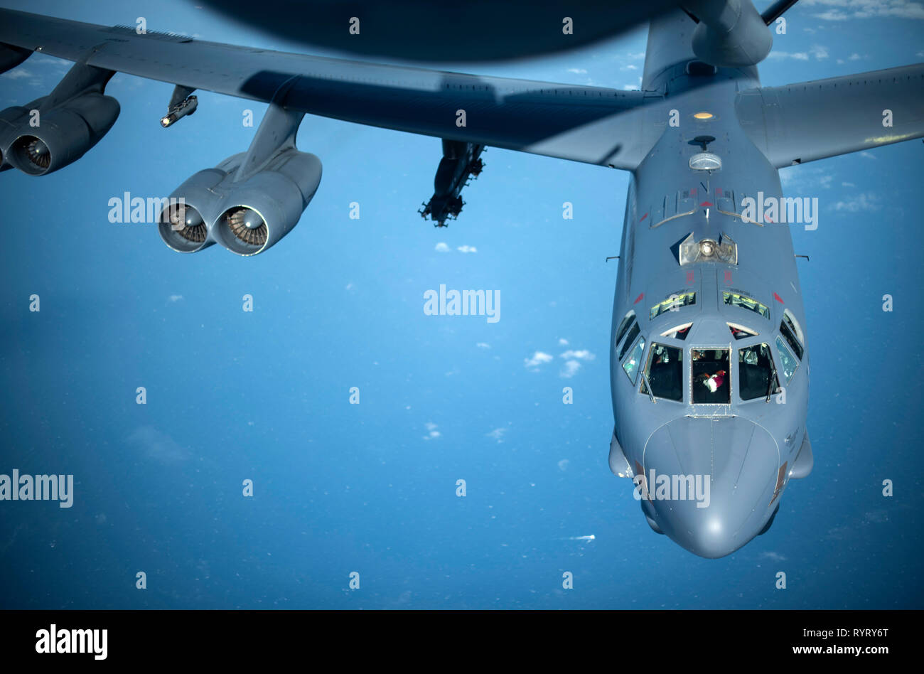 A U.S. Air Force B-52 Stratofortress approaches a KC-135 Stratotanker ...