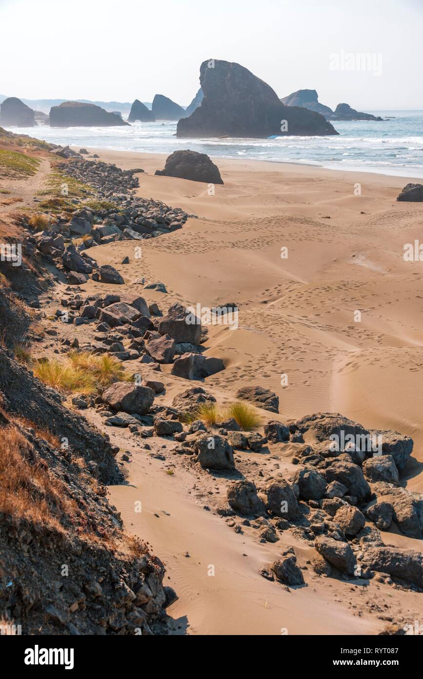 Coastal landscape, sandy beach with rugged rocks, Myers Creek Beach ...