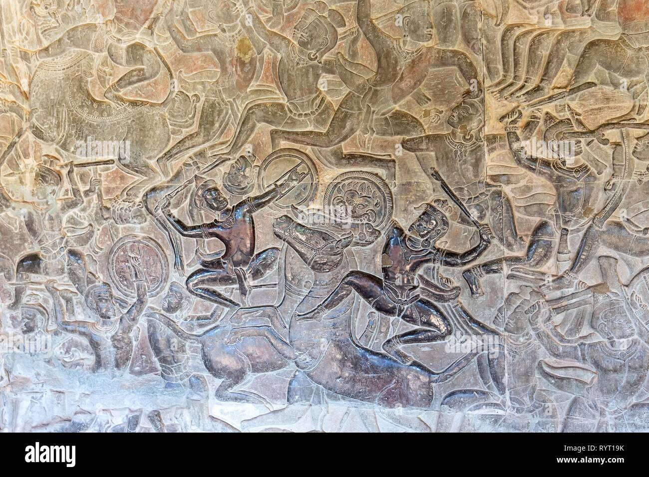 Stone relief, fighters, detail of Battle of the Gods, stone carving ...