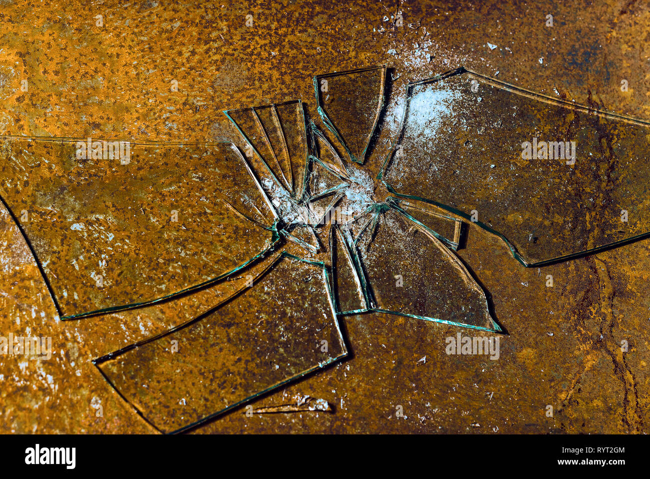 broken glass against a rusty metal background. texture Stock Photo - Alamy