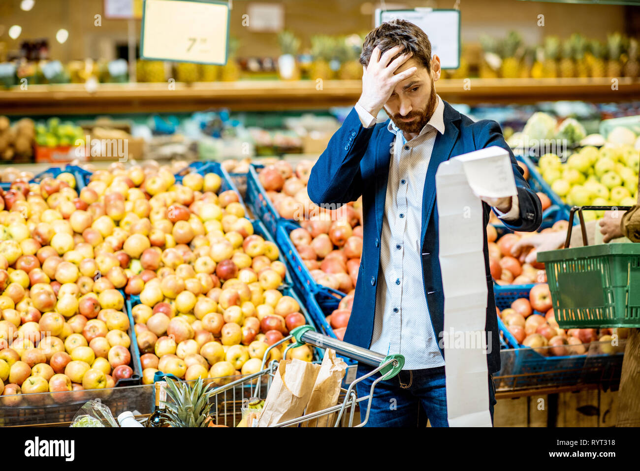 Portrait of an elegant man with shocked emotions holding very long ...