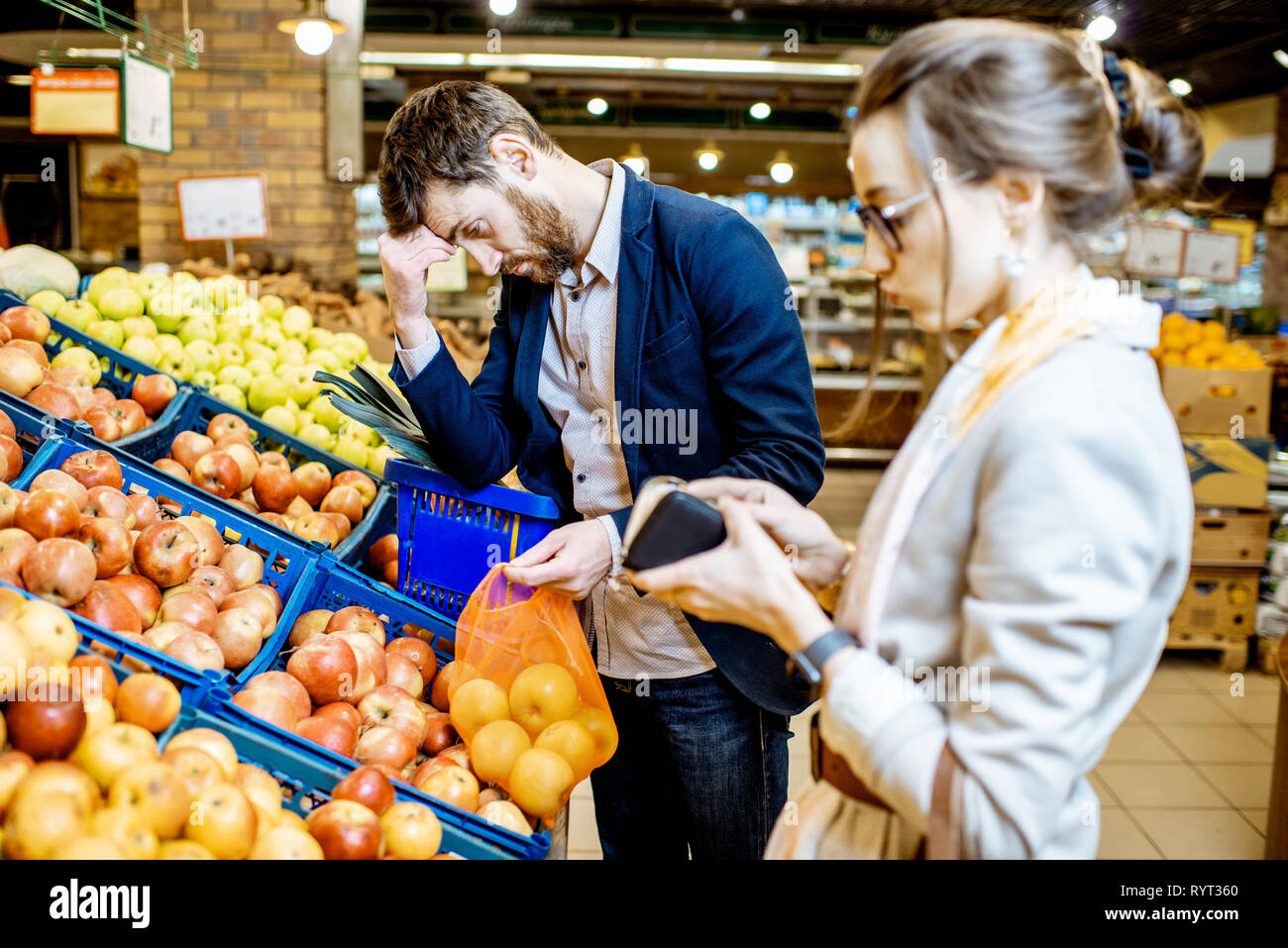 Sad couple with despired emotions having a problem with their budget ...