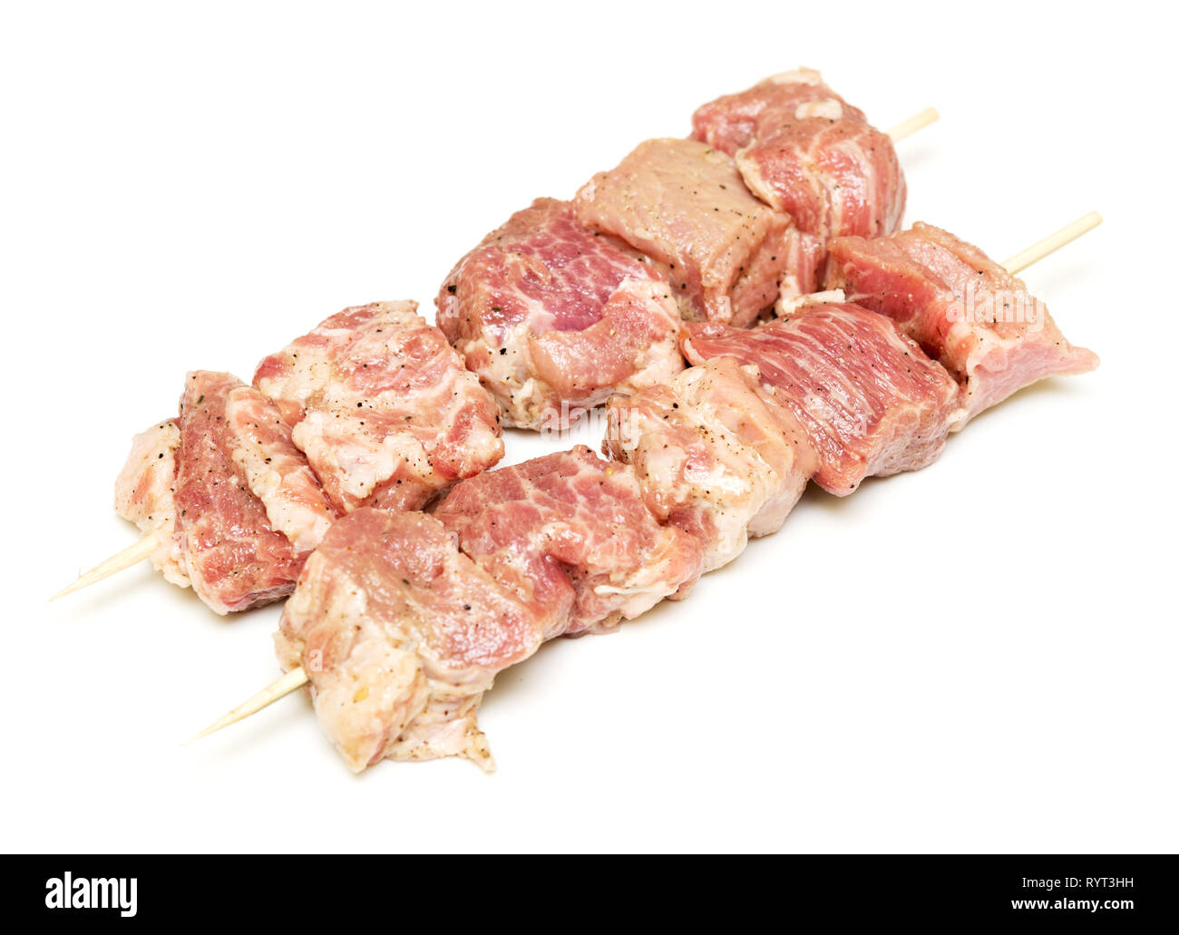 Two raw kebabs isolated on white background Stock Photo - Alamy
