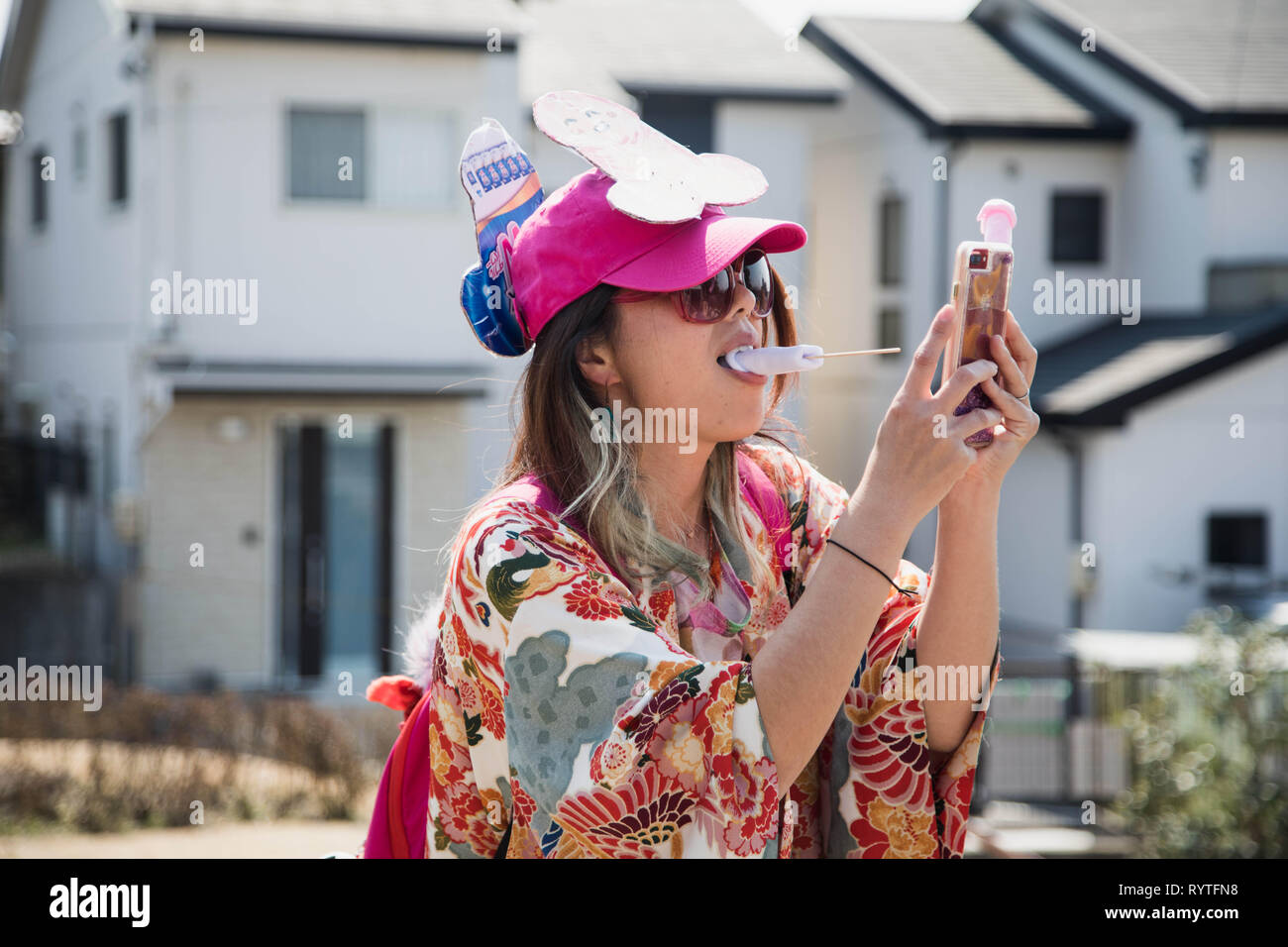 Komaki, Aichi, Japan. 15th Mar, 2019. A woman seen taking a selfie with ...