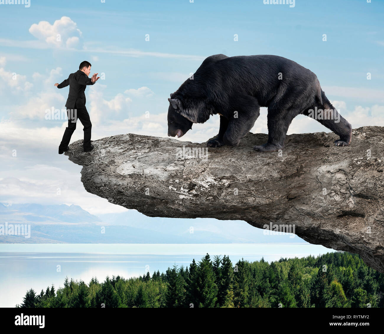 Businessman against black bear balancing on cliff with sky trees ...