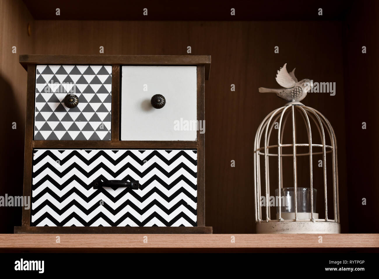 Little drawer with decorative candle cage Stock Photo - Alamy