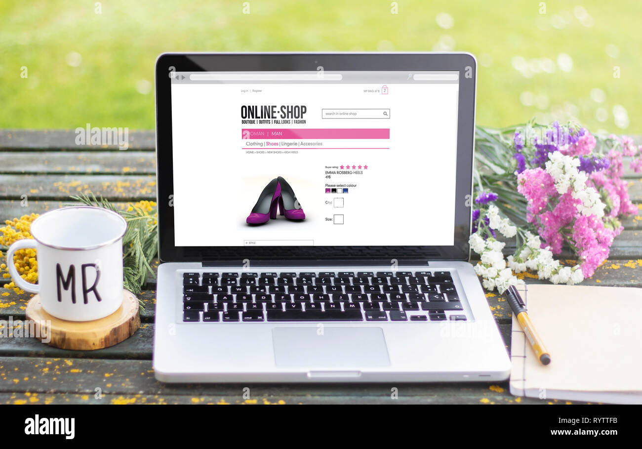 Laptop on spring table with flowers Stock Photo - Alamy