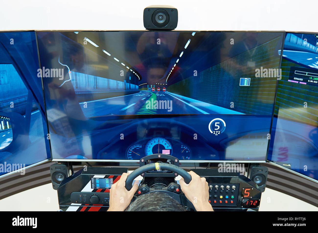 Man plays on a computer racing simulator Stock Photo - Alamy