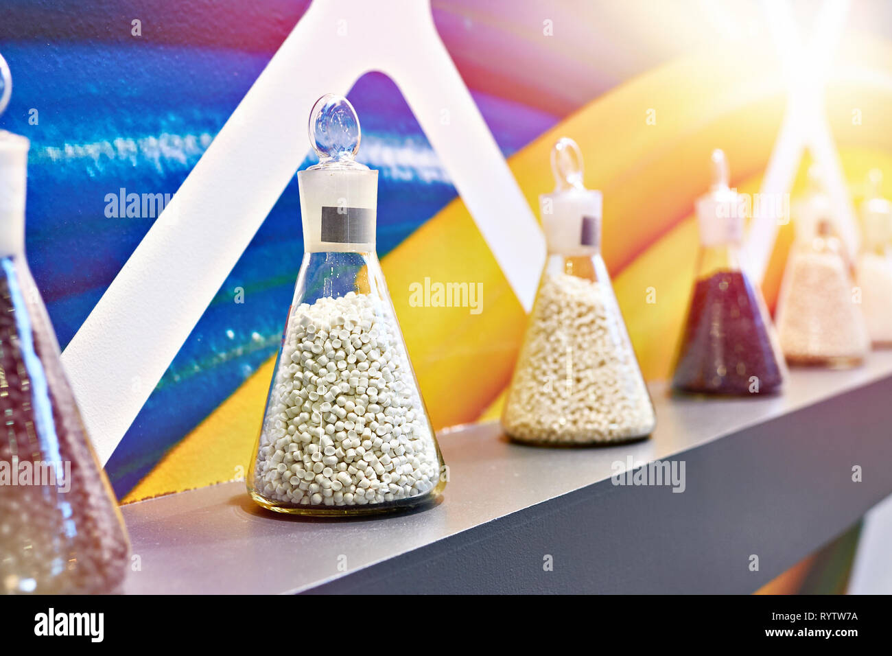 Plastic granular polymer. Samples in flasks Stock Photo - Alamy