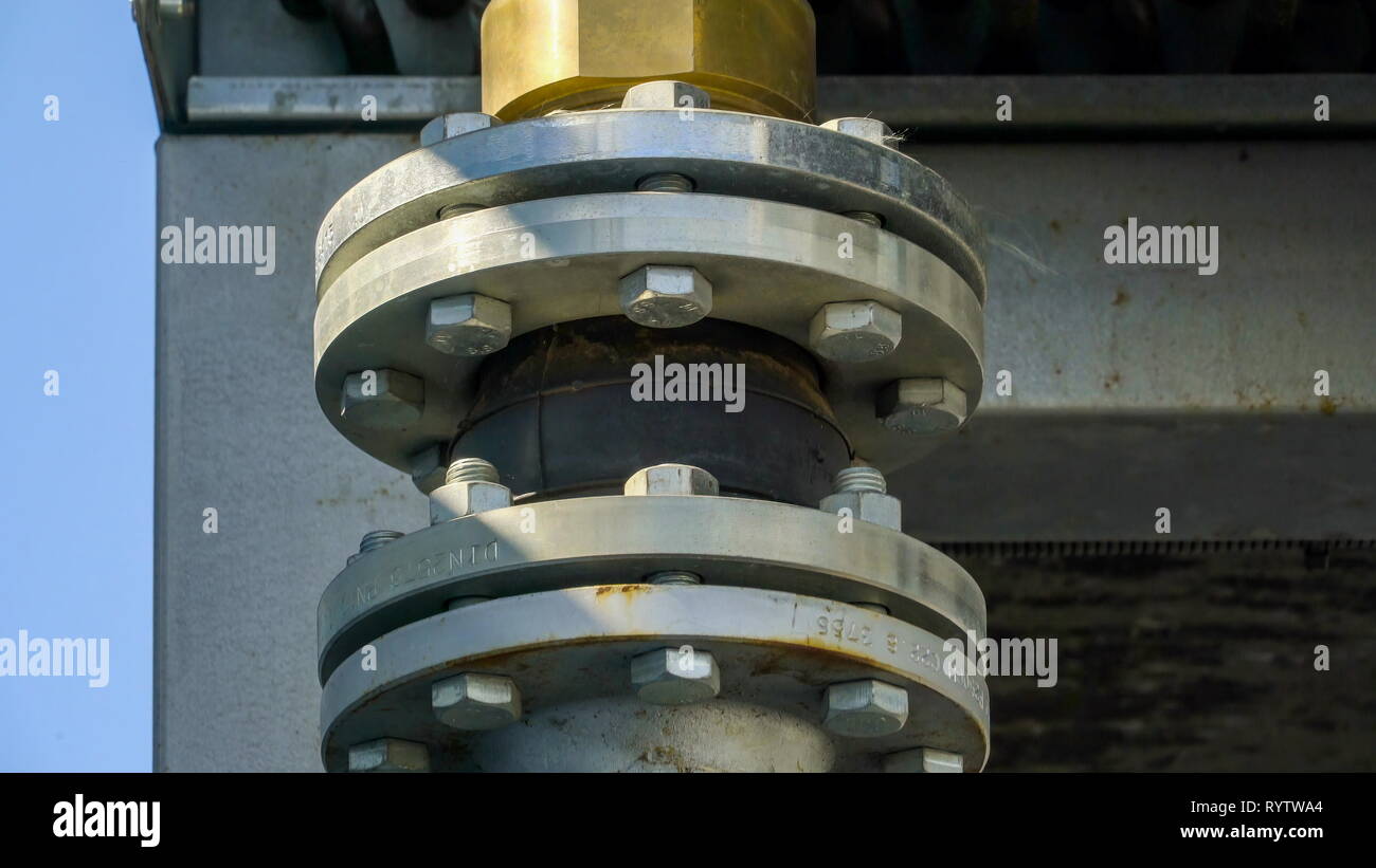 Big screws from the big pipes with the red arrow sign on the top of it ...