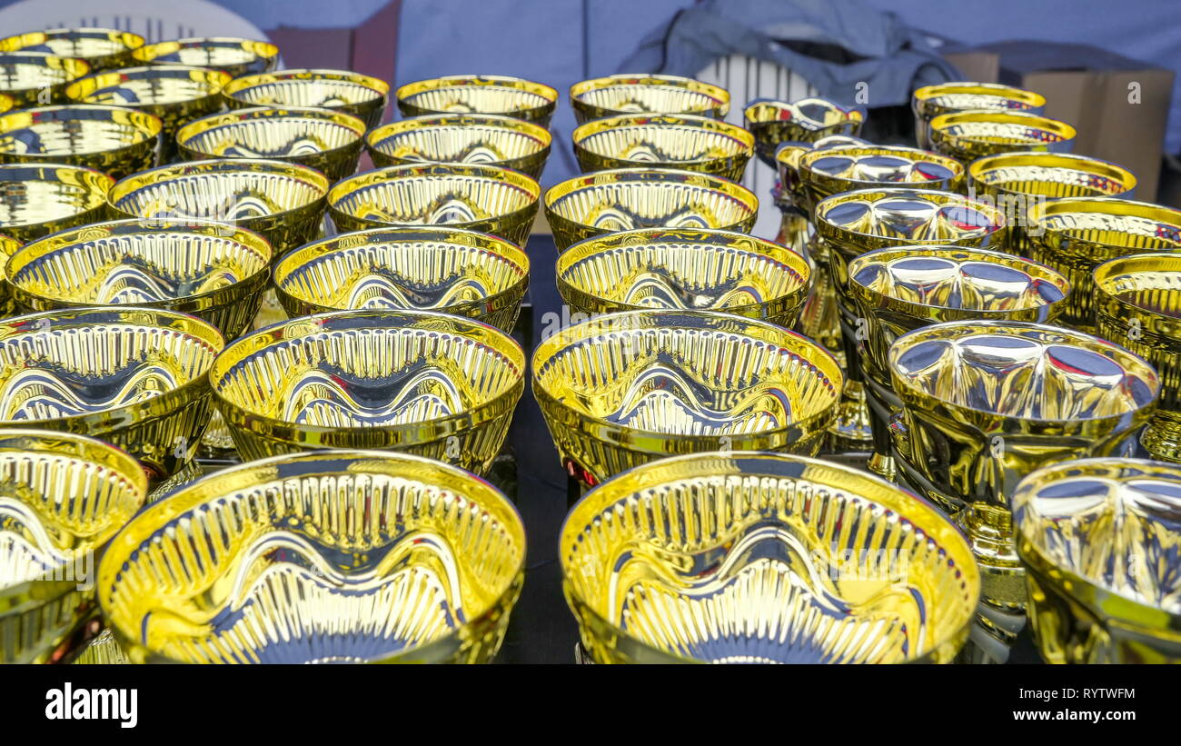 Closer look of the top of the gold trophies displayed in the table for ...