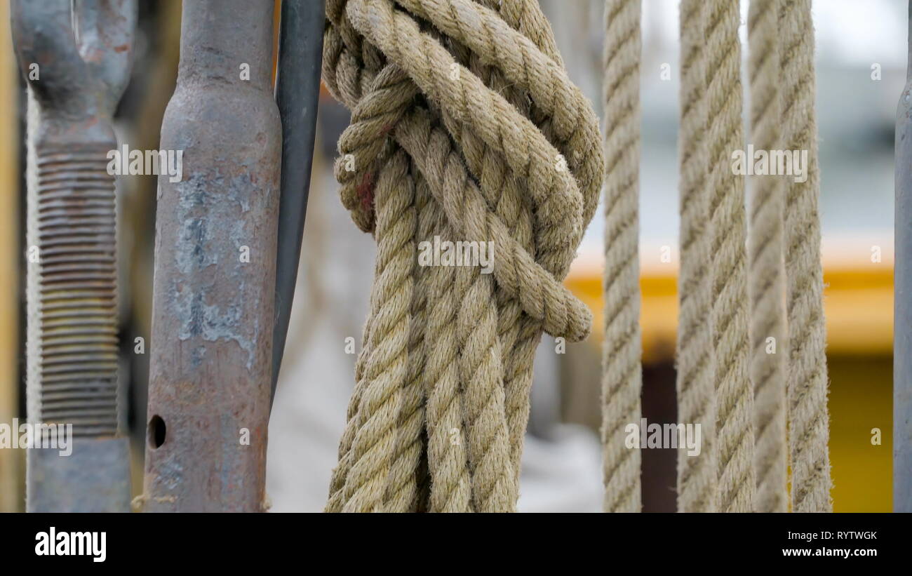 A rope in knot tie on the vessel hanging on the center of the ship ...