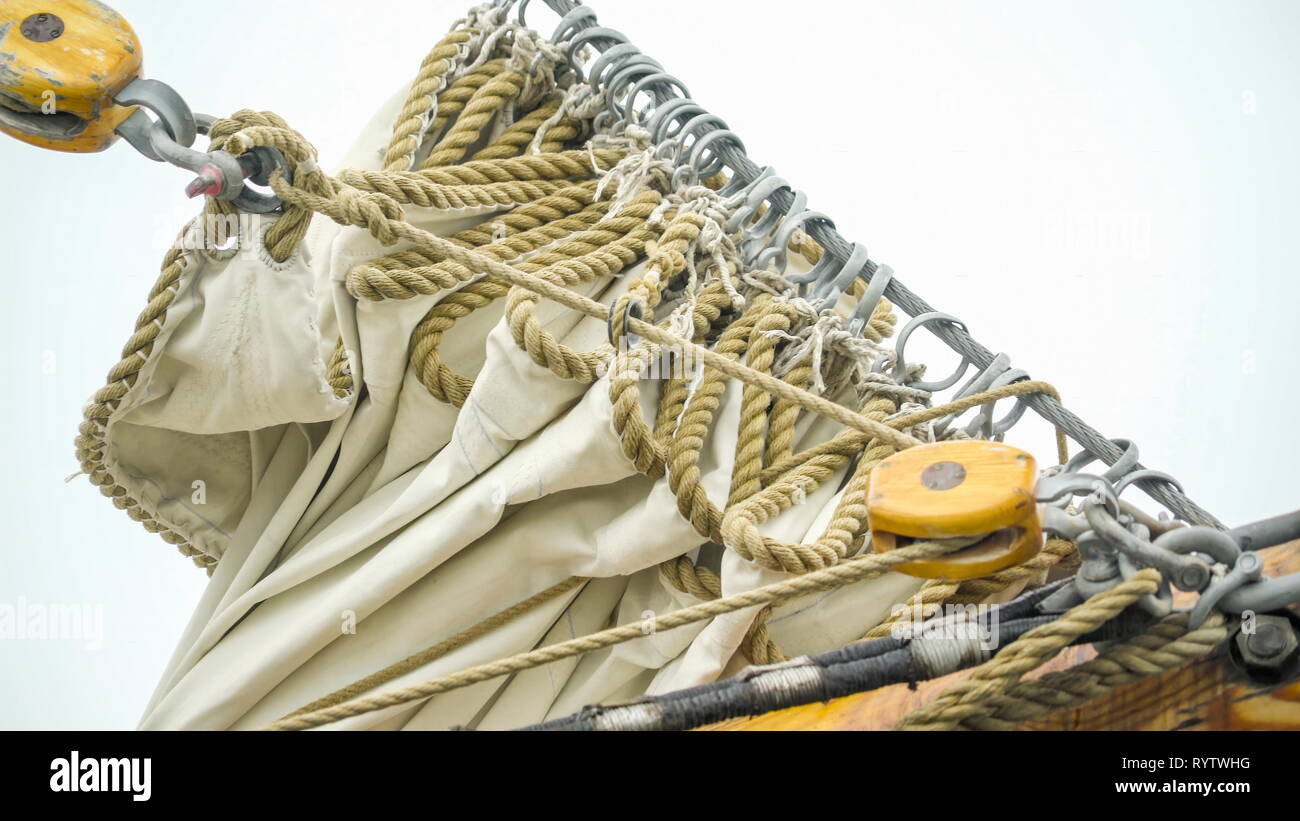 Ropes and chains on the velum of the ship with the poles that helps in ...