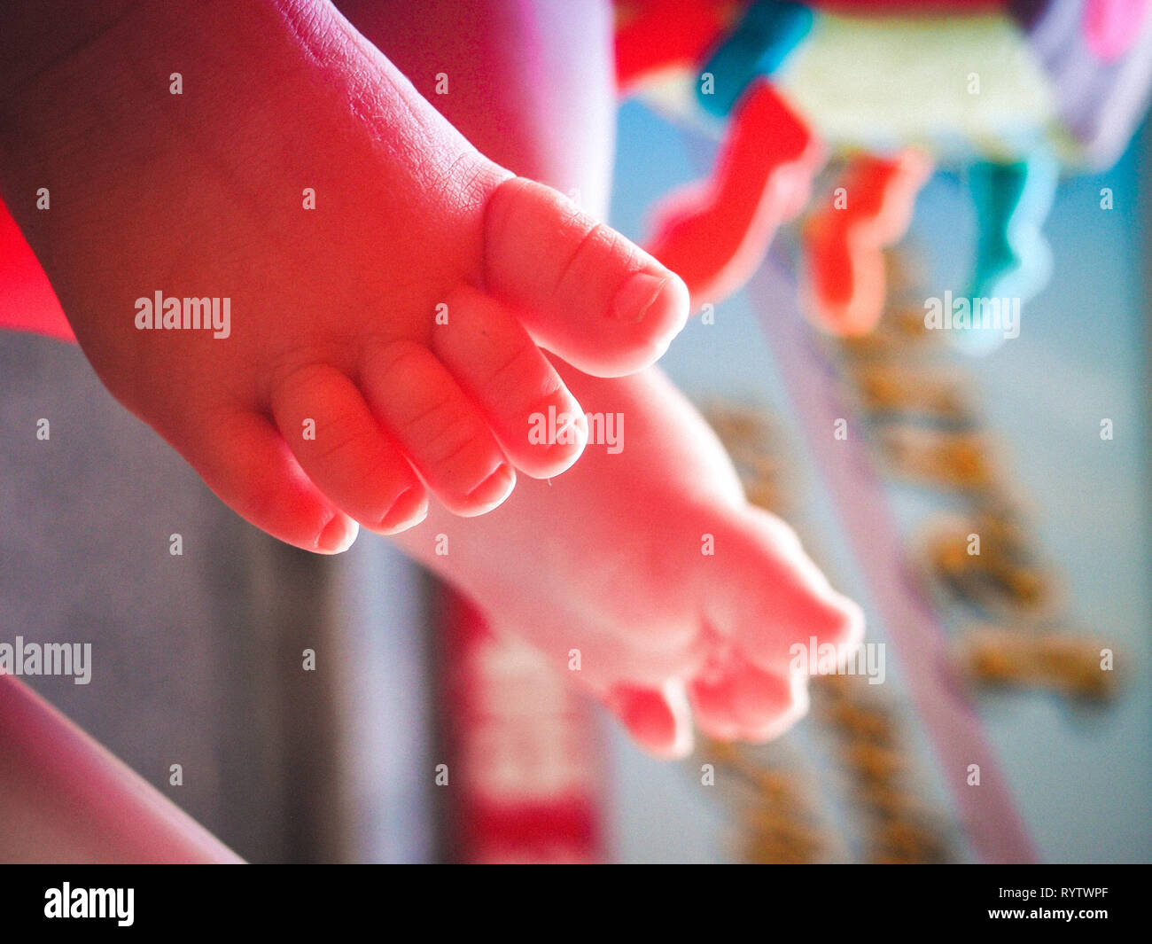 New baby feet and toys hi-res stock photography and images - Alamy