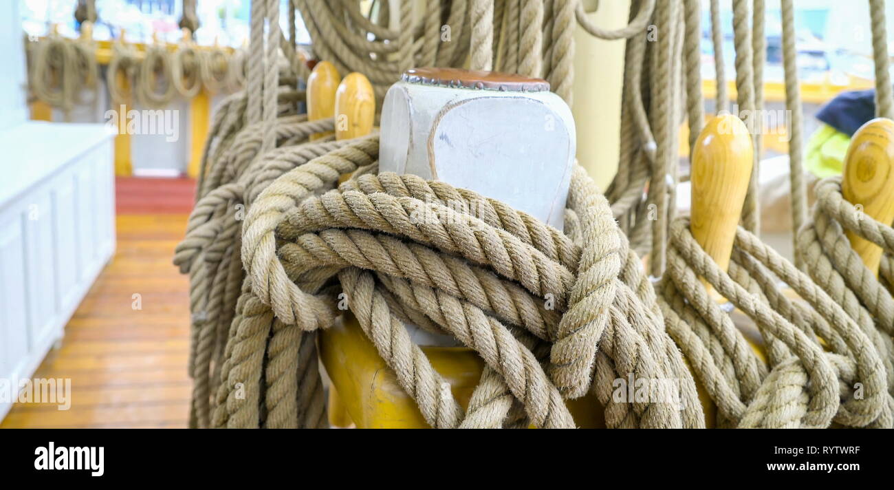 The ropes tied on the side poles of the rope connecting the big poles ...