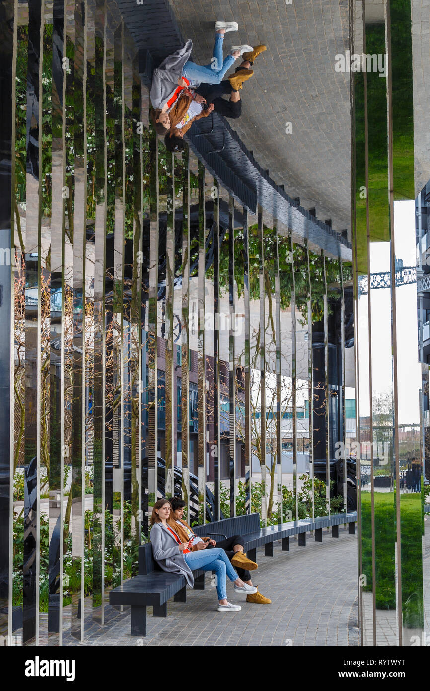 The mirrored walkway around Gasholder Park. Framed by restored ...