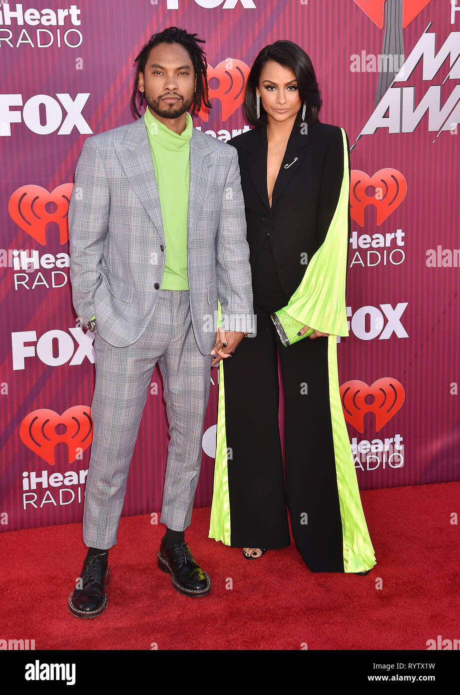 LOS ANGELES, CA - MARCH 14: Miguel (L) and Nazanin Mandi attend the ...