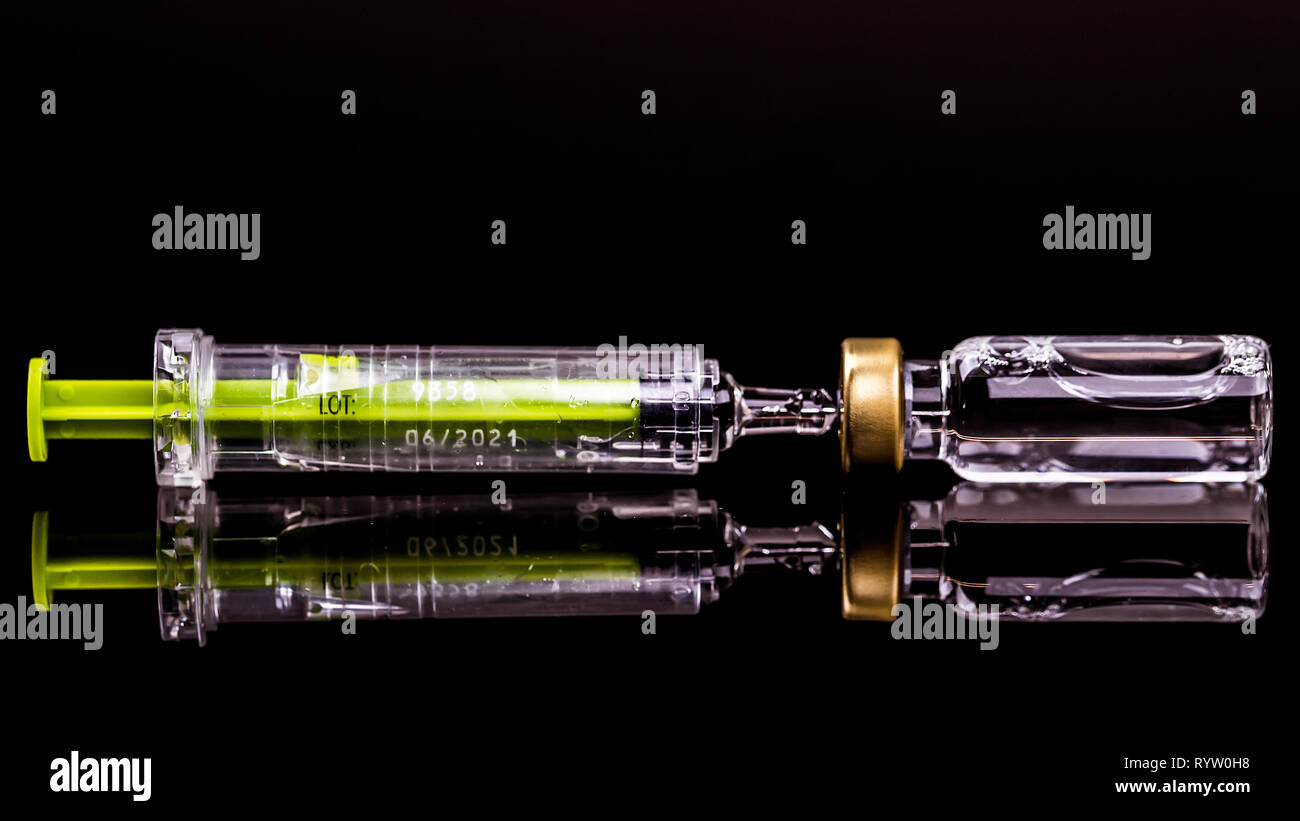 Sterile medical vials with medication solution, ampoules, and syringe ...