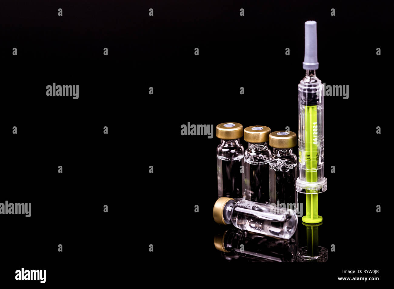 Sterile medical vials with medication solution, ampoules, and syringe ...