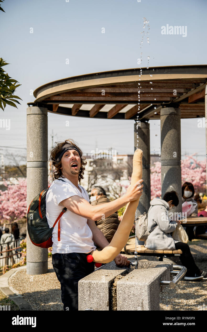 A man seen posing with a phallus during the festival. Honen festival is ...