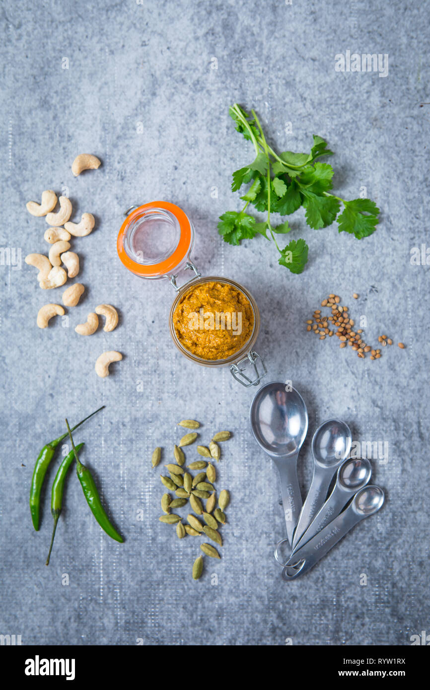 Korma curry paste spices with grey background. Ingredients for fresh ...