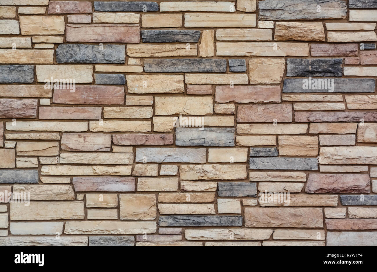 Brown colored stone setting. Cut stone wall texture Stock Photo - Alamy
