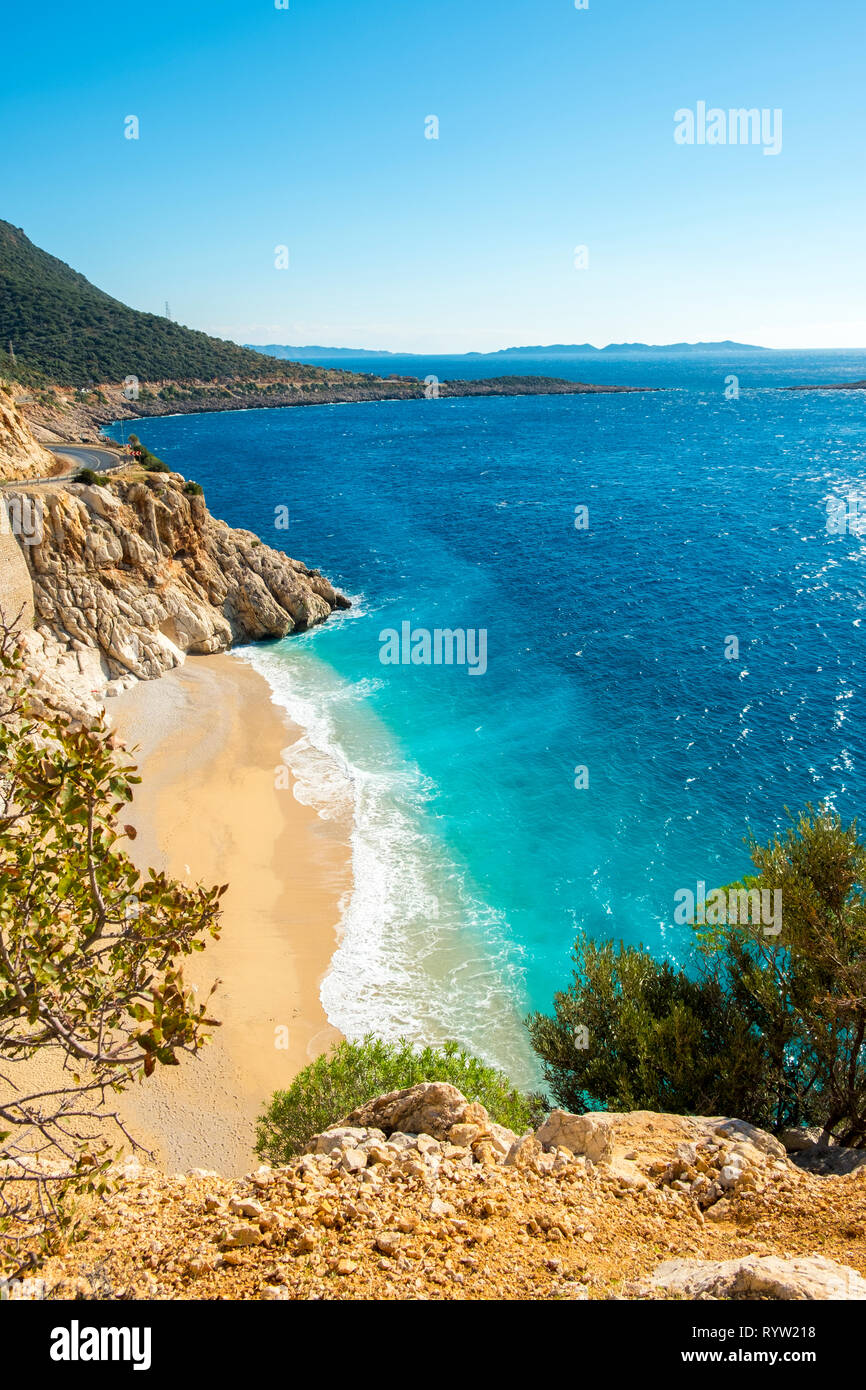 High angle clifftop view of empty turquoise water and white sand beach ...