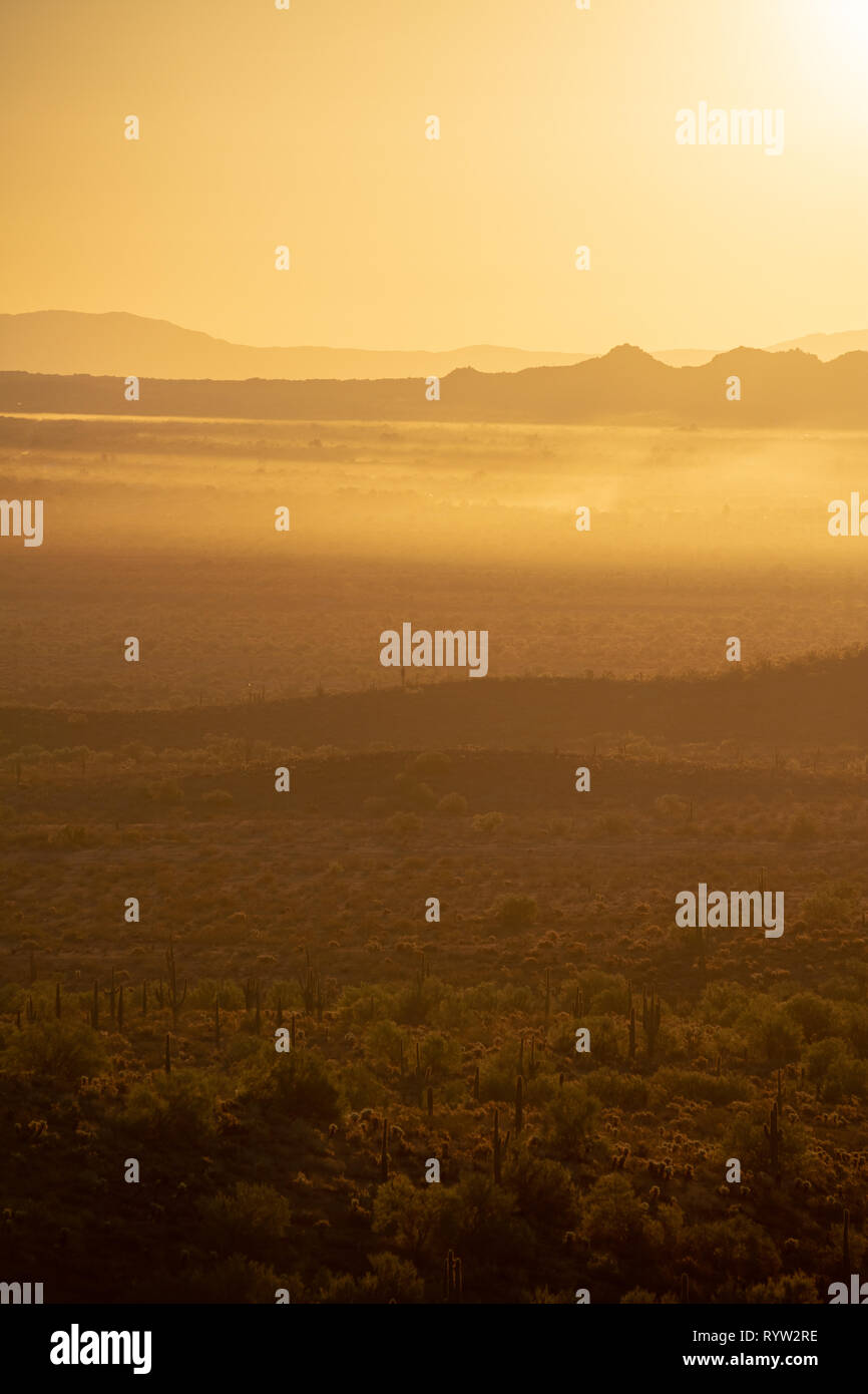 The sun rising over the mountains of the Arizona desert with natural ...