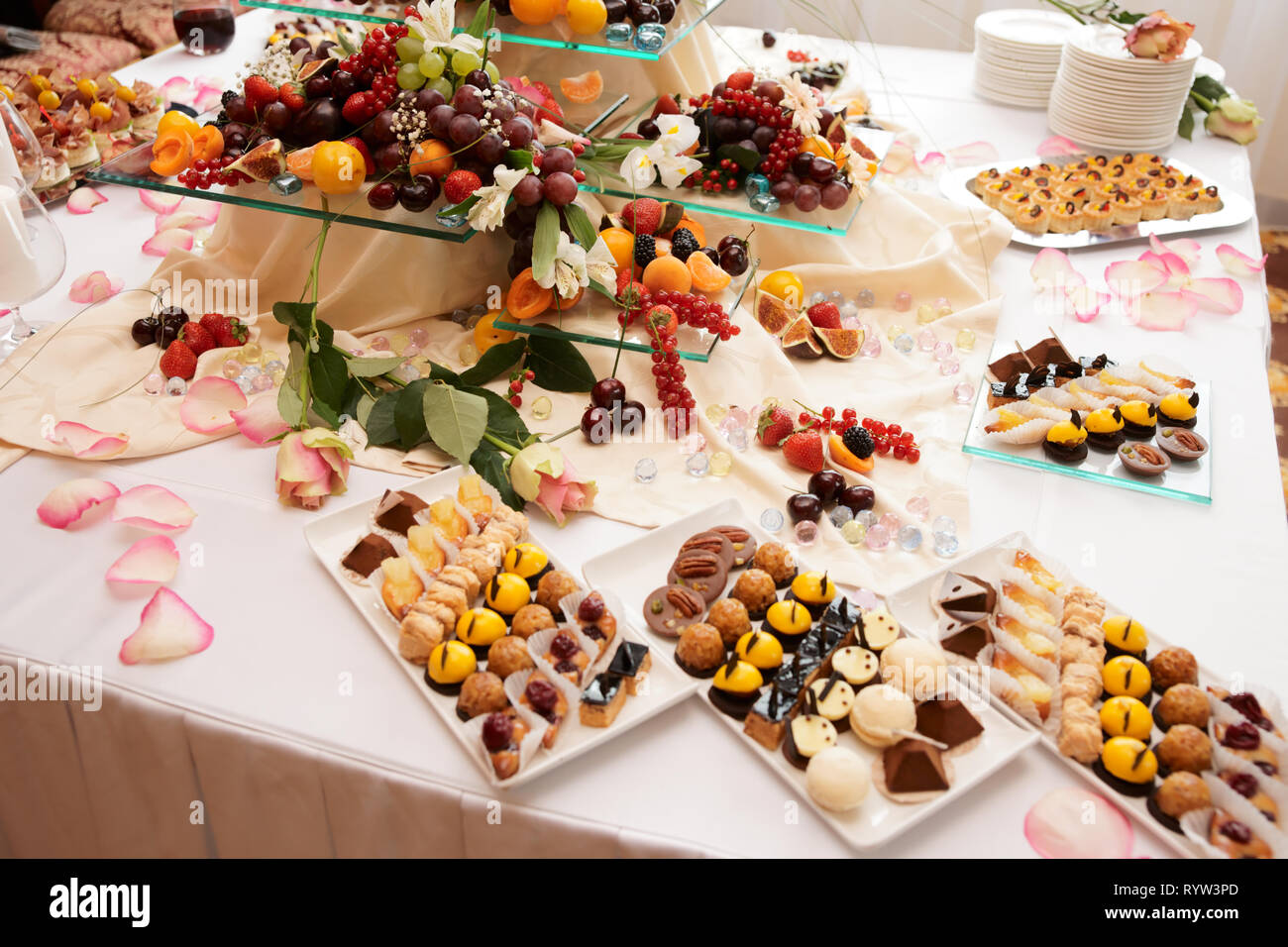 Banquet table full of sweets, fruits and berries - catering event, wide ...