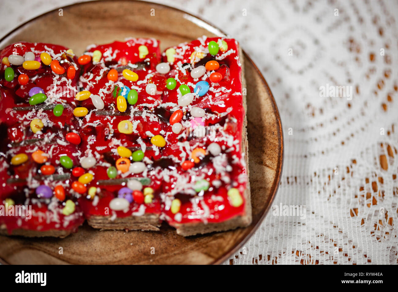 Garnished sweet wafer pastry bar with the toppings of sweet candy and ...