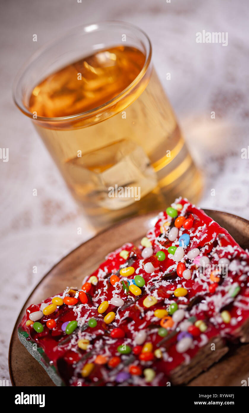 Garnished sweet wafer pastry bar with the toppings of sweet candy and ...