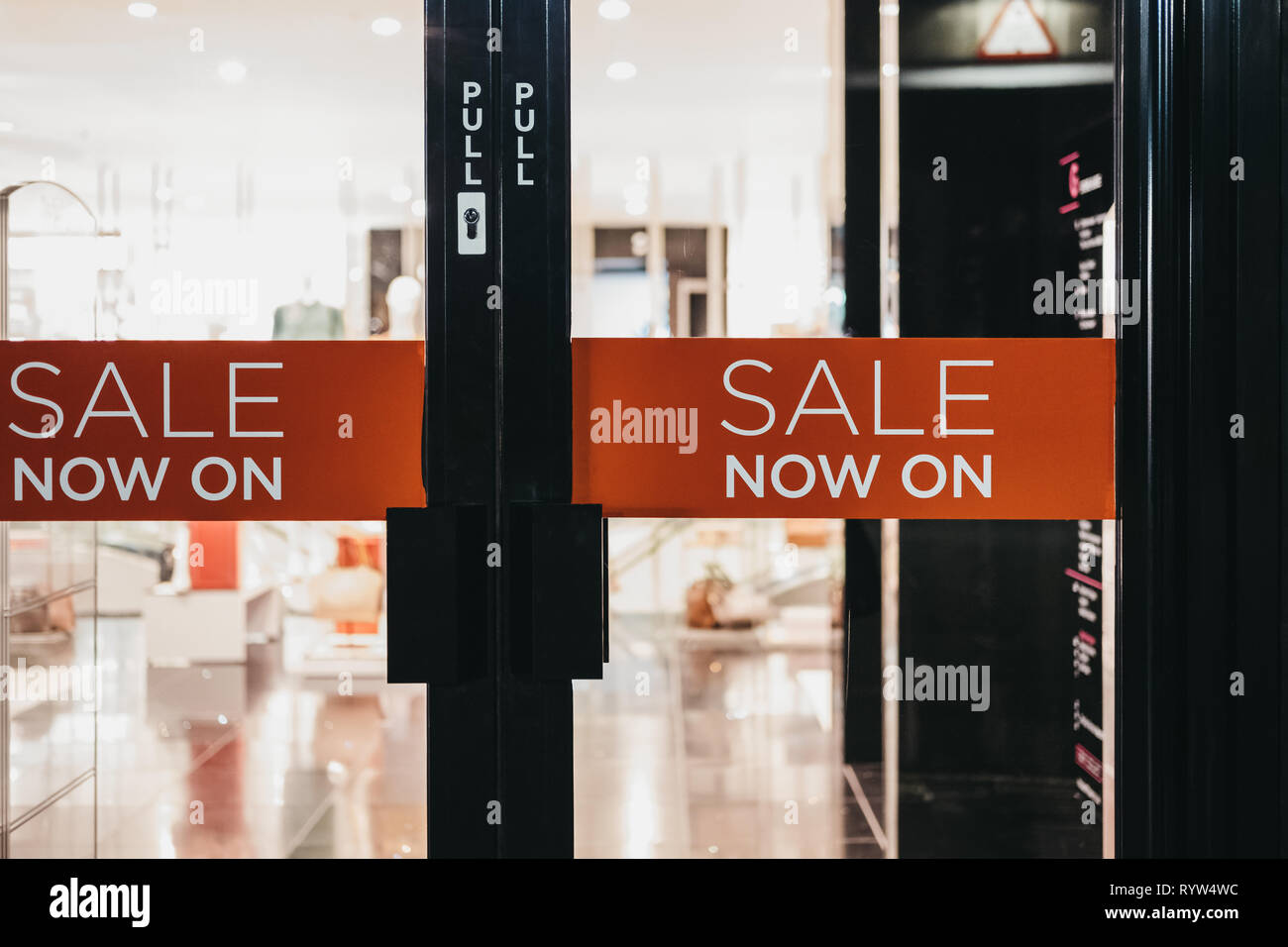 Sales now on sign on an entrance door to a shop, selective focus Stock ...