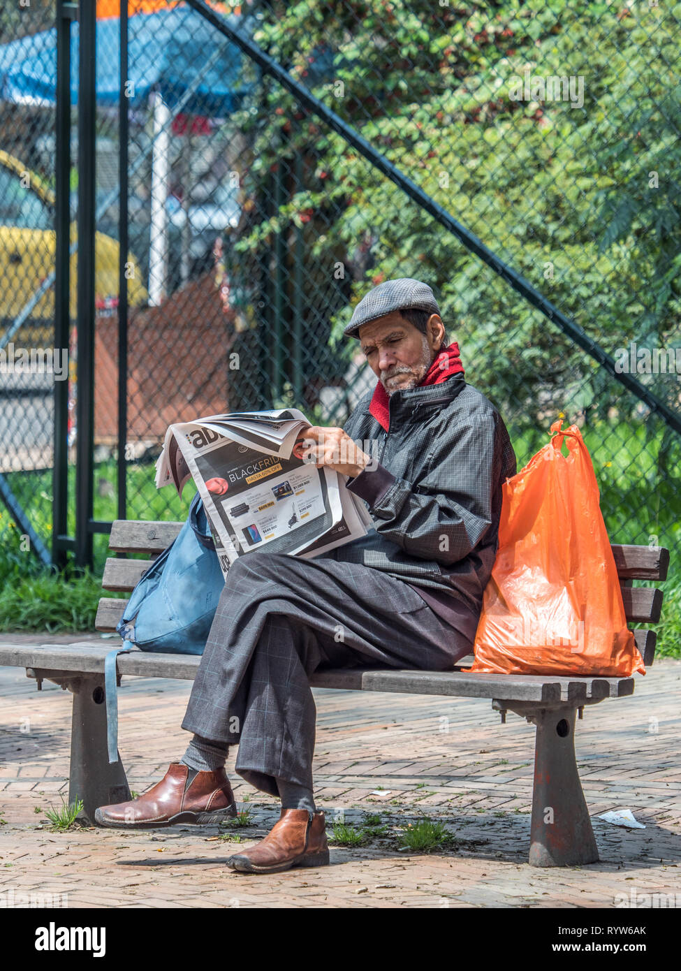 Bogota, Colombia - November 23, 2018: Man is reading the newspaper on ...
